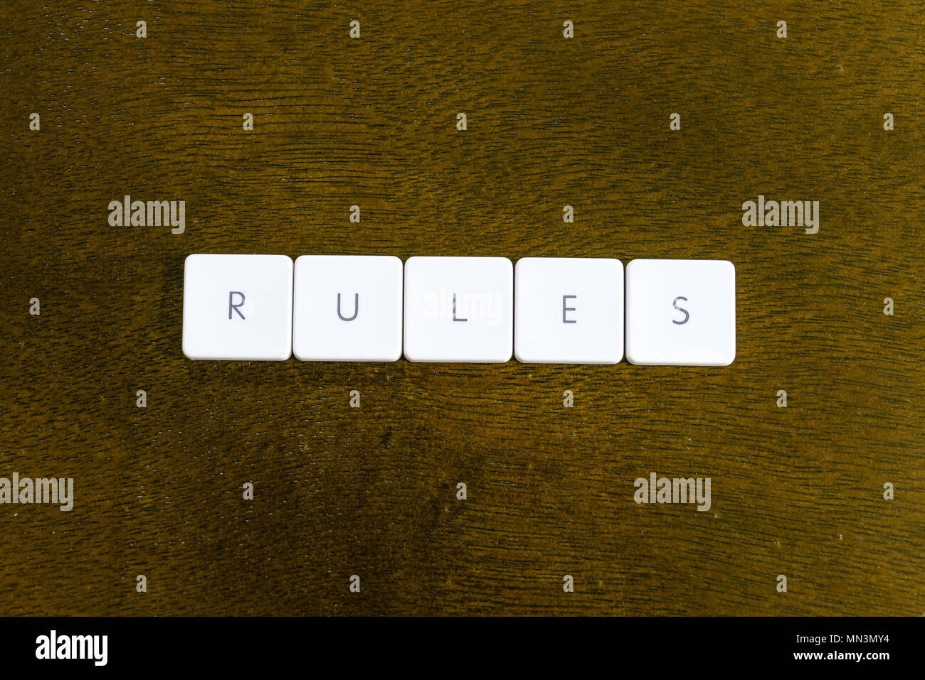 RULES word written on plastic keyboard alphabet with dark background ...