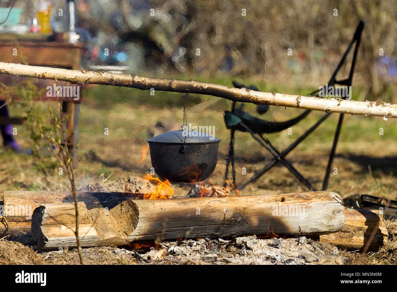 Campfire. Cooking in a Campfire at a Campfire;Cooking food on the ...