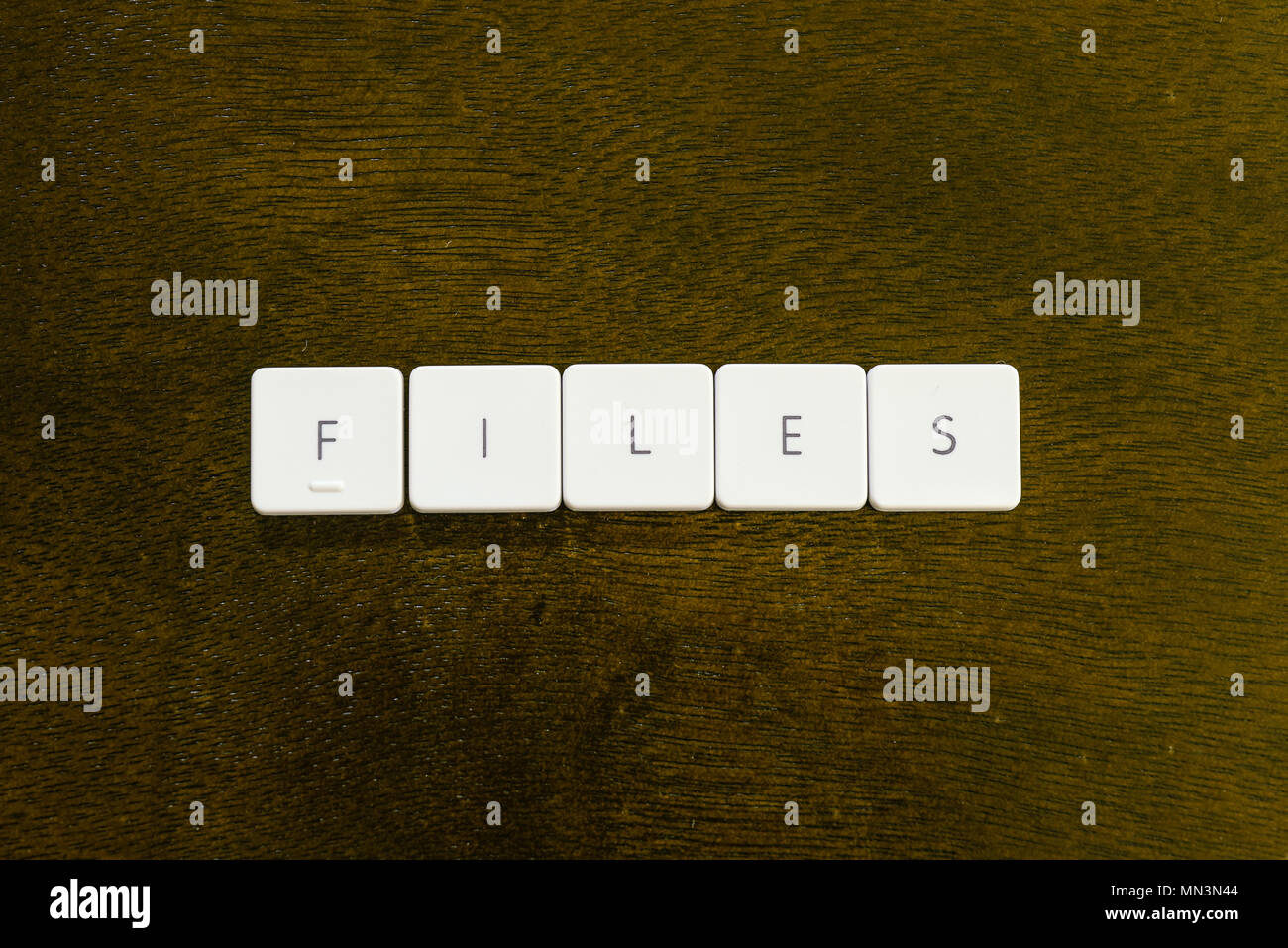 FILES word written on plastic keyboard alphabet with dark background ...
