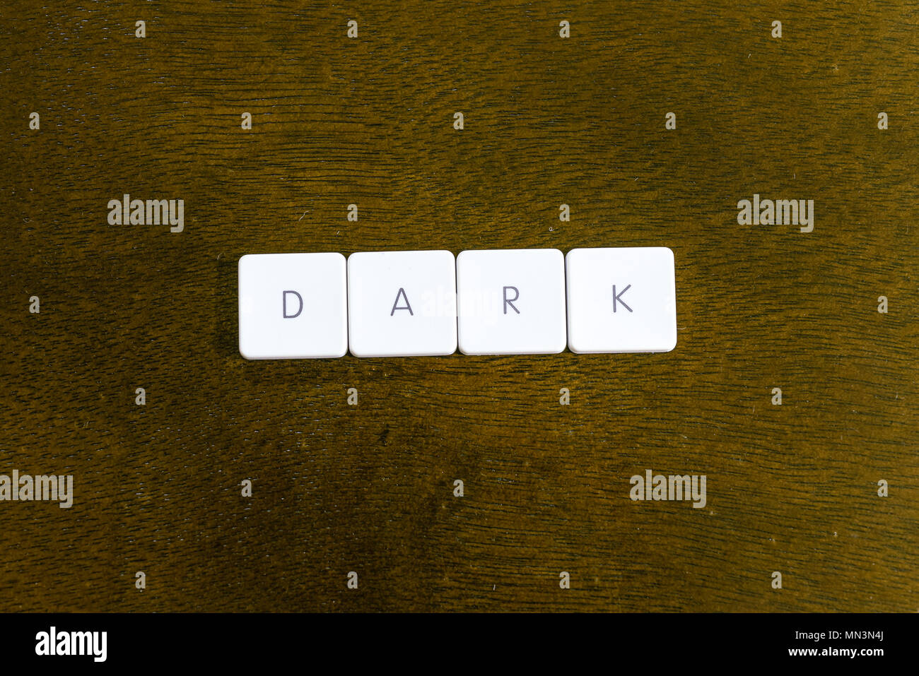 DARK word written on plastic keyboard alphabet with dark background ...