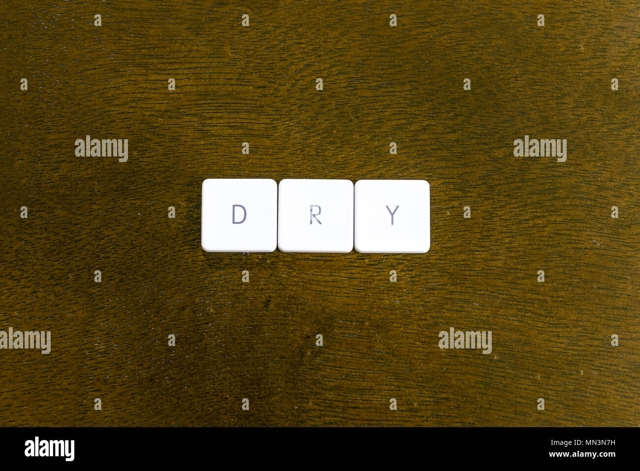 DRY word written on plastic keyboard alphabet with dark background ...