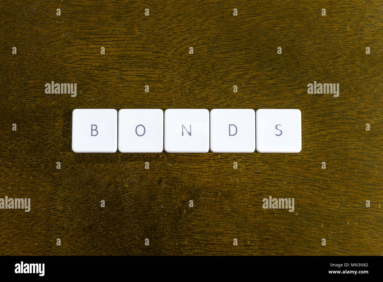 BONDS word written on plastic keyboard alphabet with dark background ...