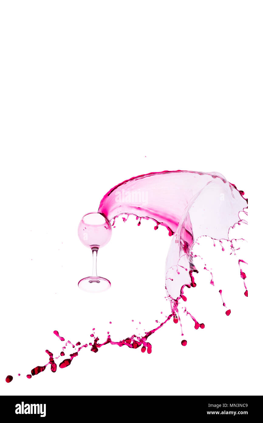 Falling wine glass with splashes of red wine on white isolated ...