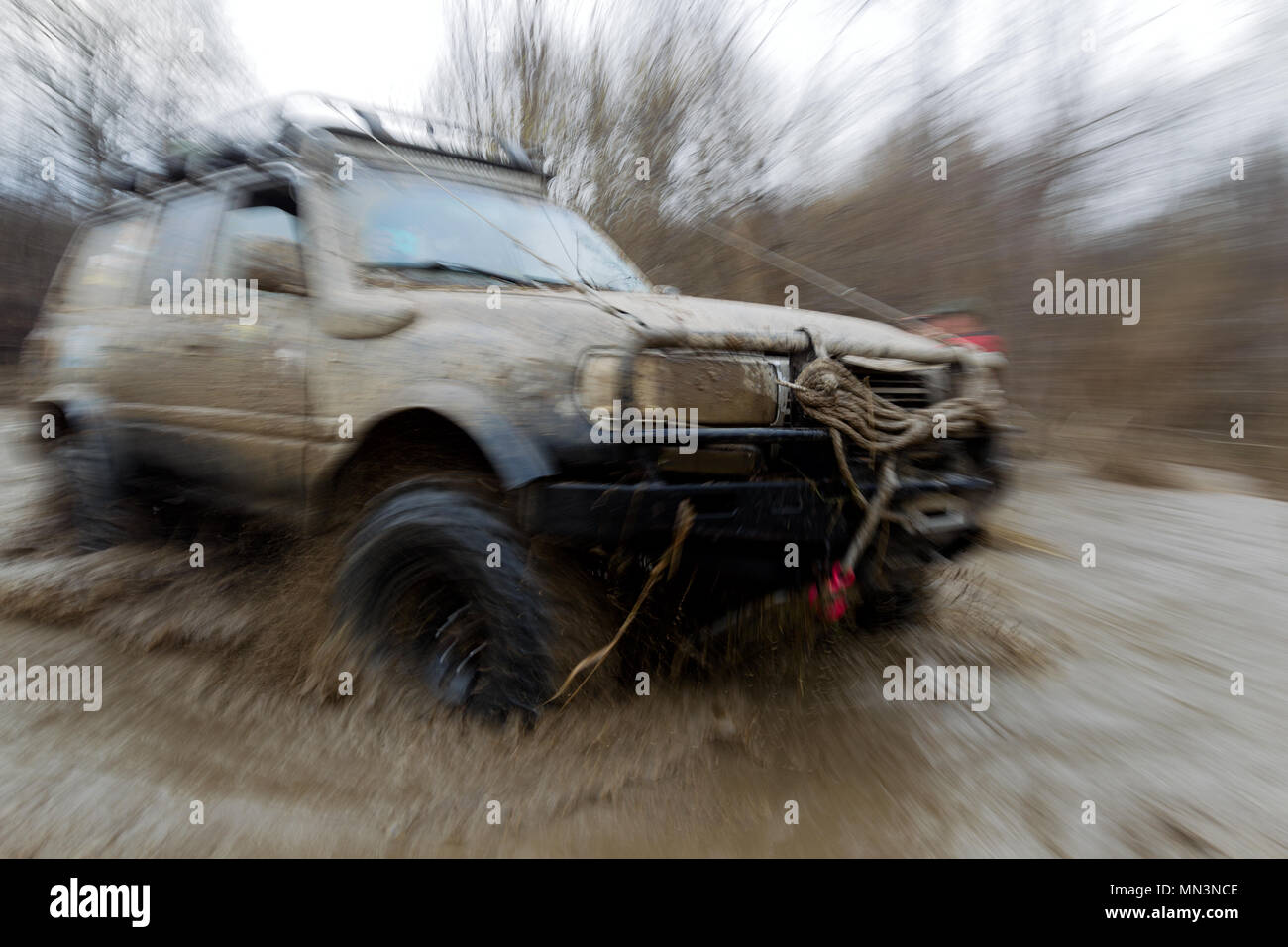 Off-road tourism. The car off-road moves the river to the ford Stock ...