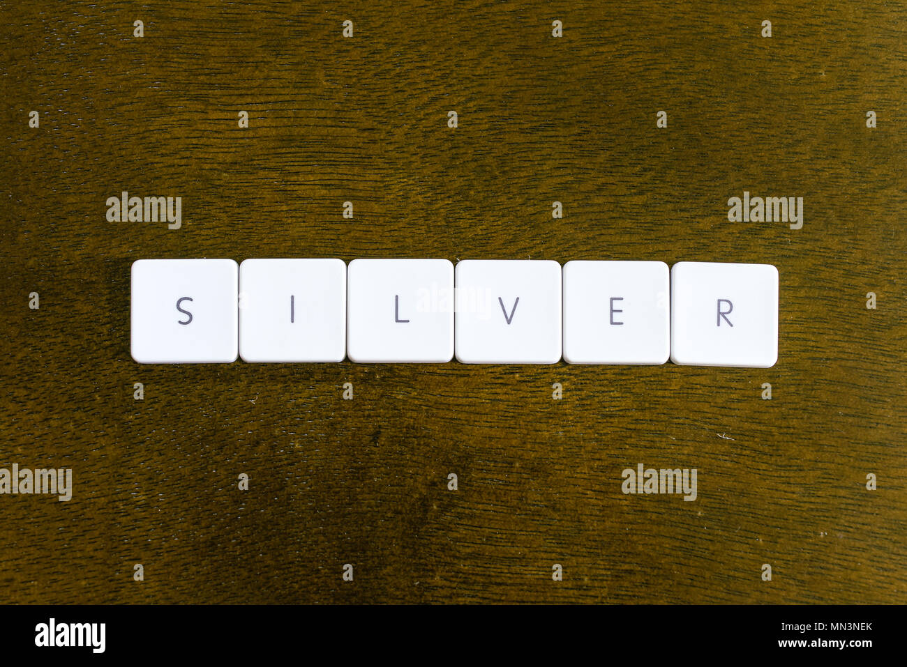 SILVER word written on plastic keyboard alphabet with dark background ...