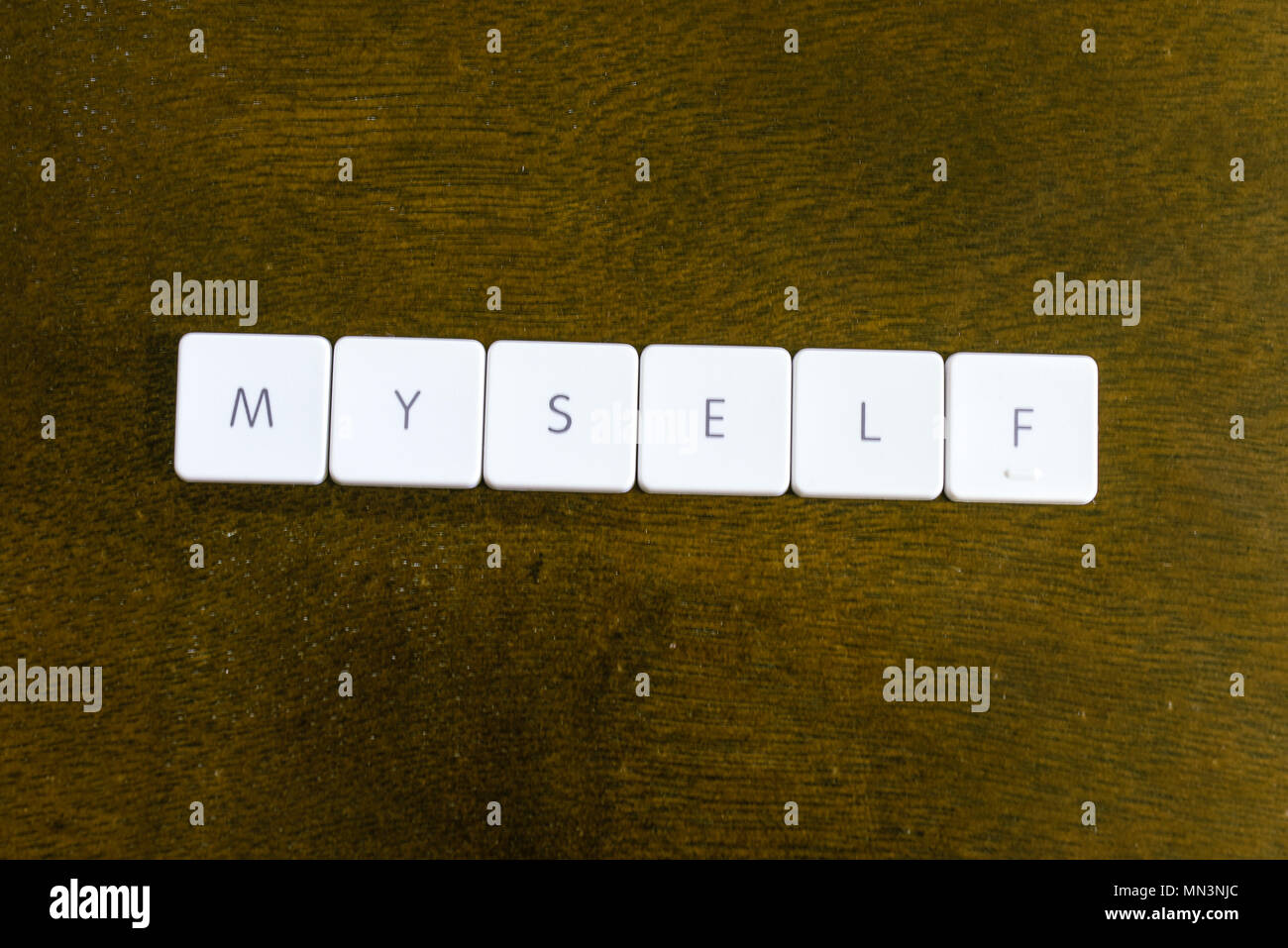MYSELF word written on plastic keyboard alphabet with dark background ...