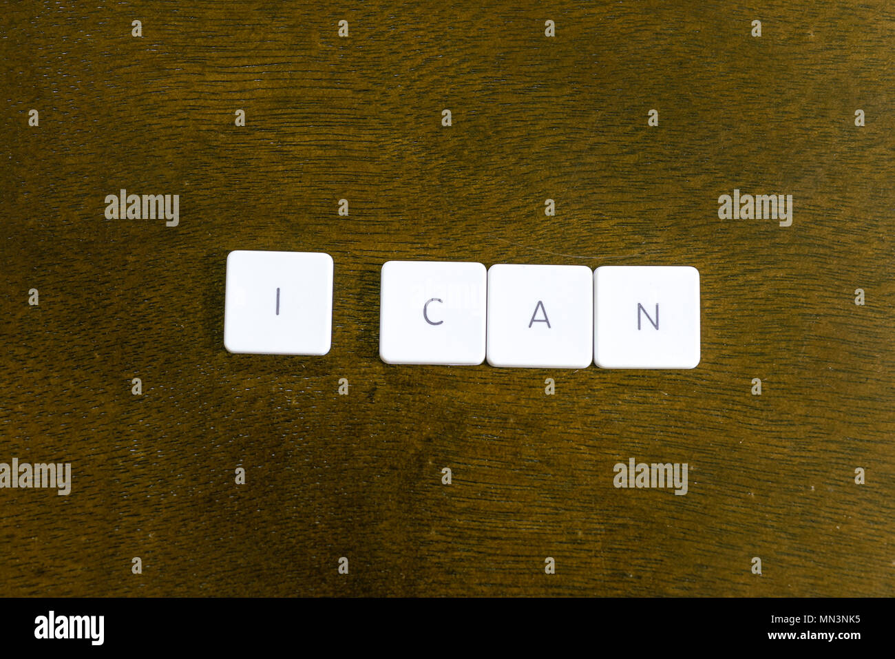 I CAN word written on plastic keyboard alphabet with dark background ...