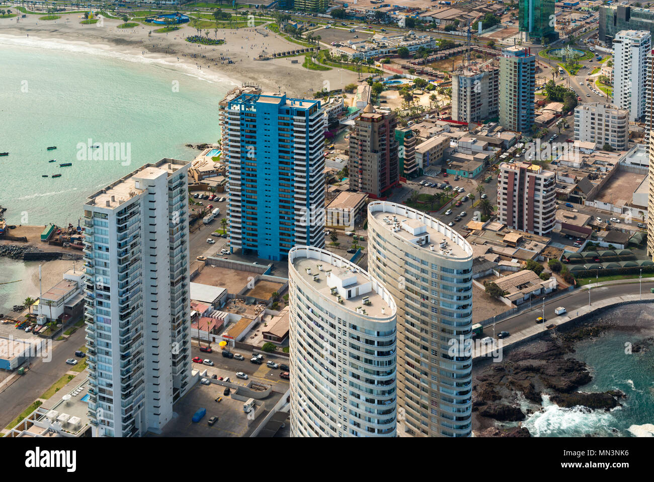Aerial view of apartment buildings at La Peninsula and Cavancha Beach ...