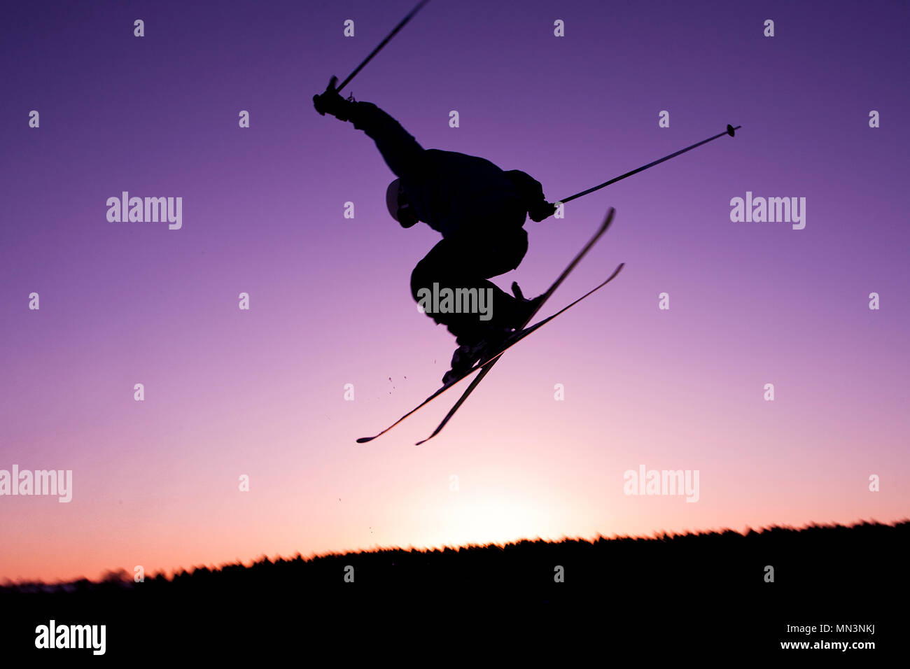 Silhouette of the skier flying at sunset background. Soft focus Stock ...