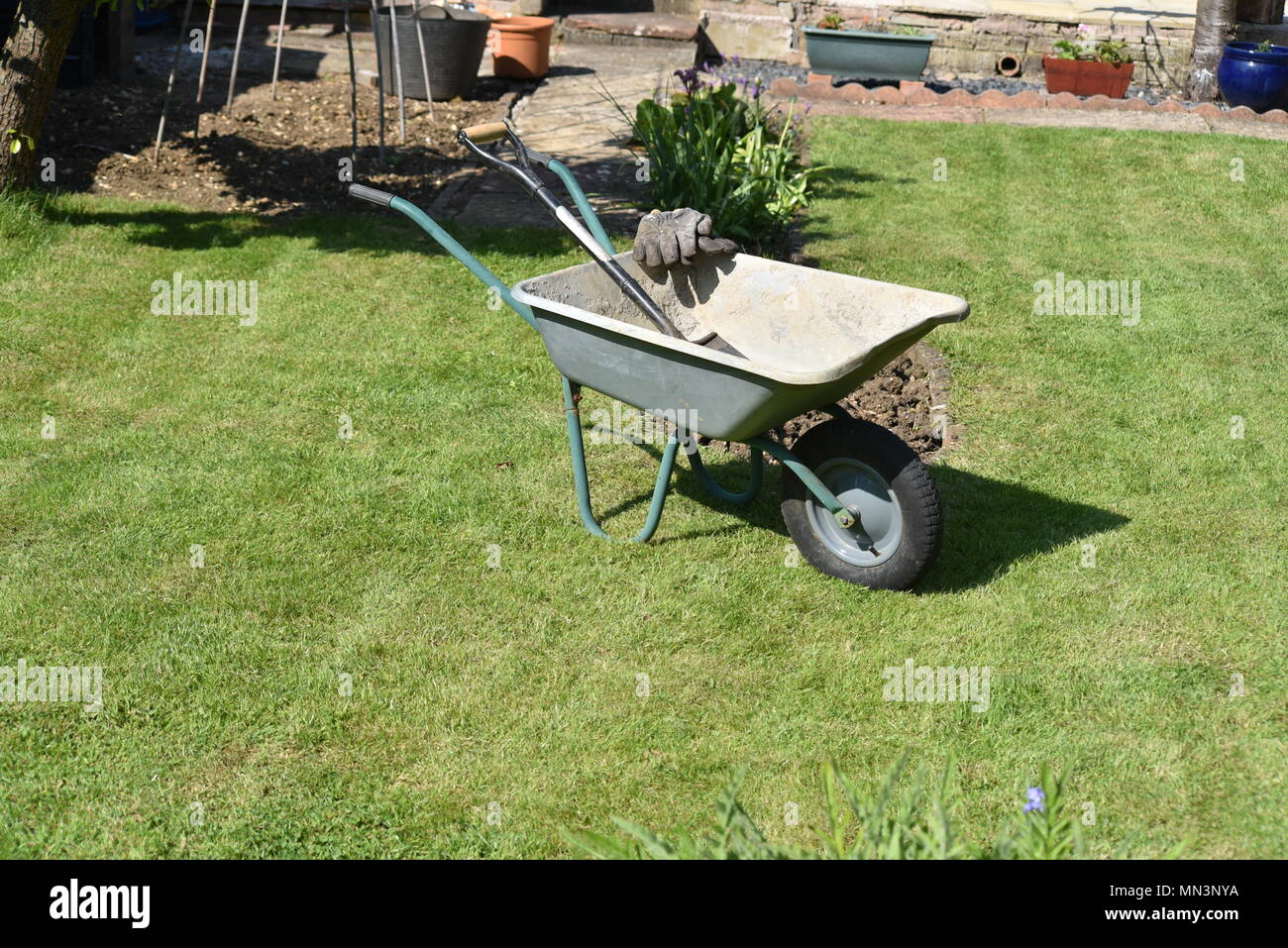 garden tools in the wheel barrow Stock Photo - Alamy