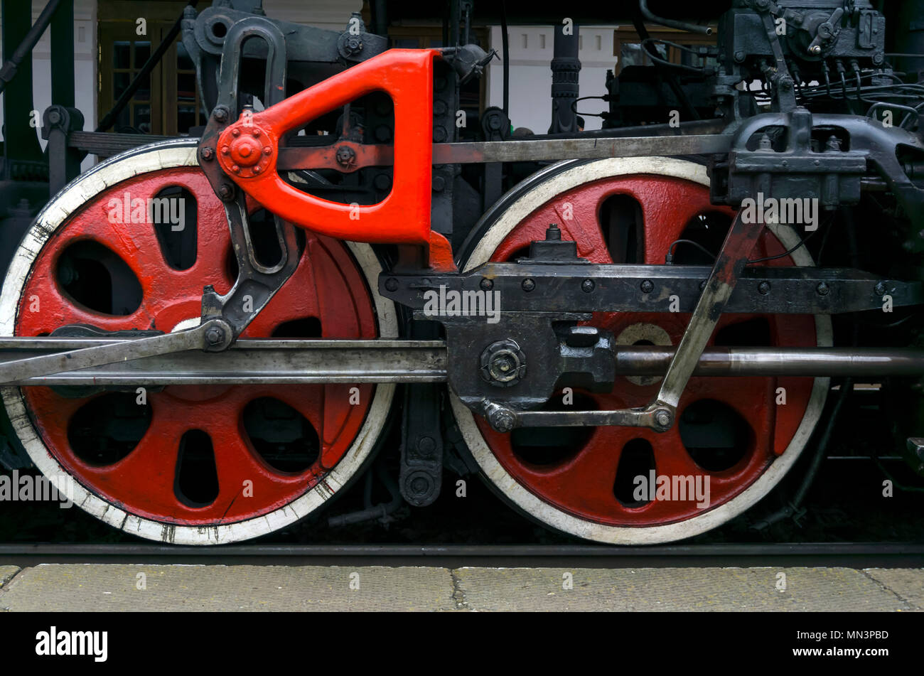fragment of vintage functioning steam locomotive standing at station ...