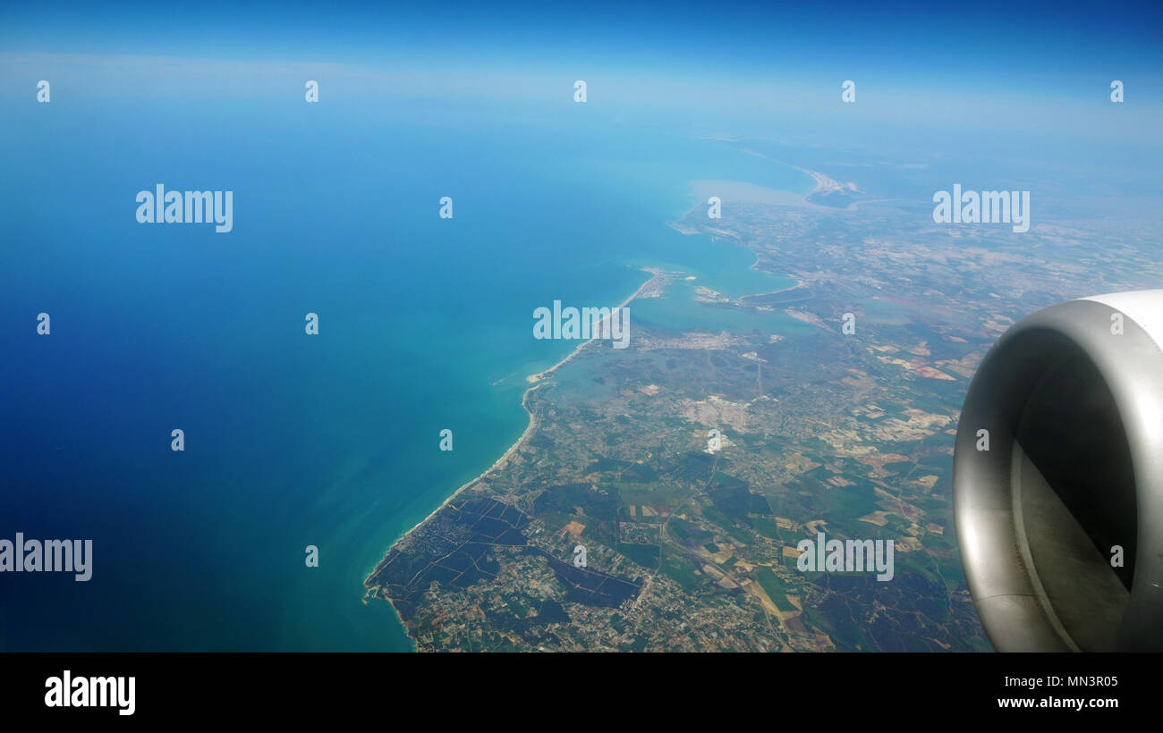 Aerial view of the Atlantic Ocean with African coast and jet turbine ...