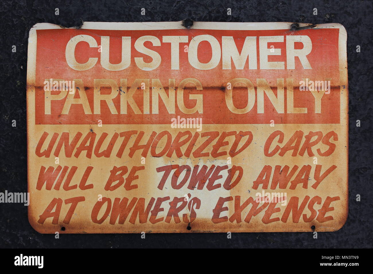 Vintage and weathered sign that states "Customer Parking Only Stock ...