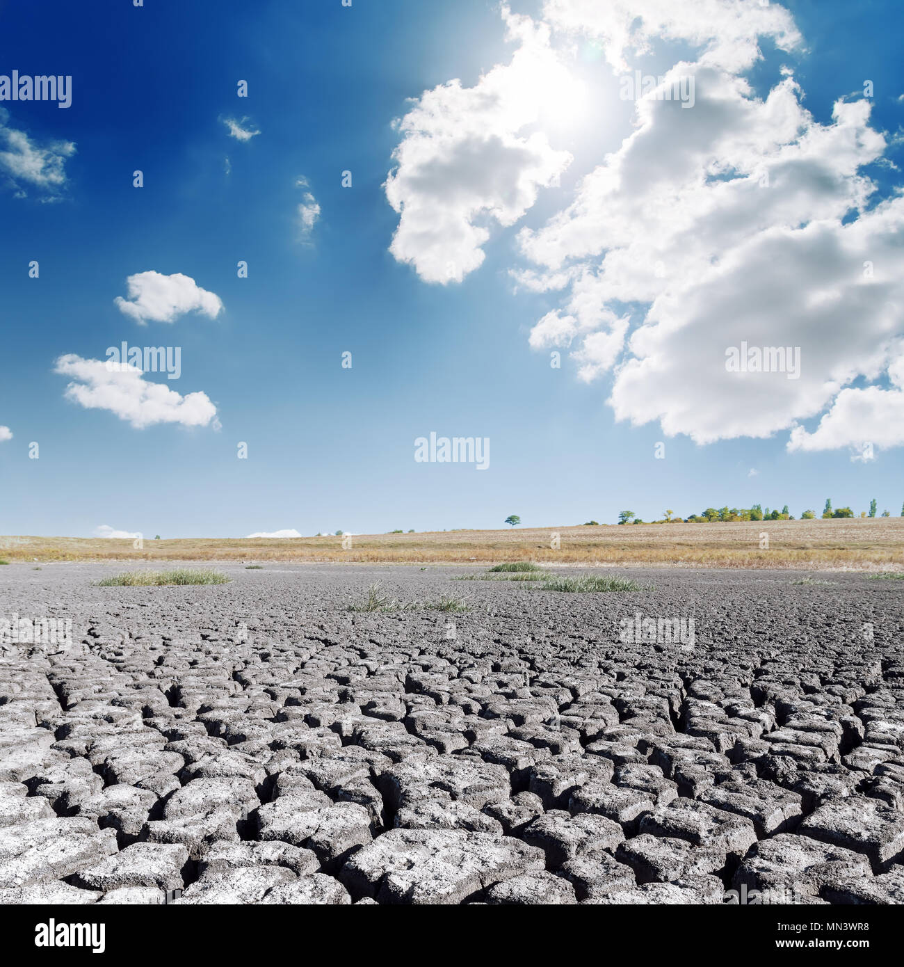 drought land and hot sun in blue sky with clouds. global warming Stock ...