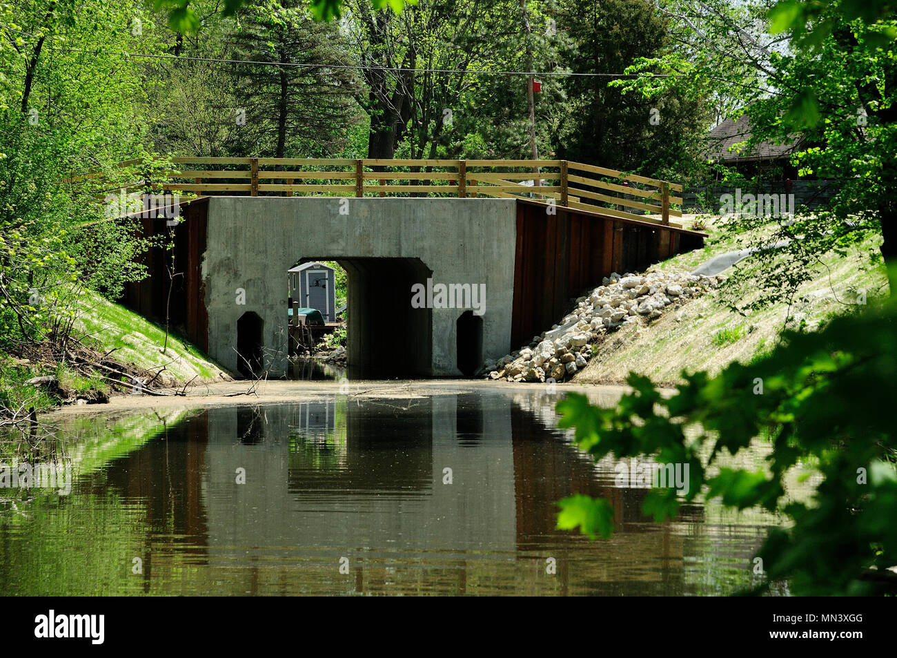 Newly built bridge crossing river channel Stock Photo - Alamy