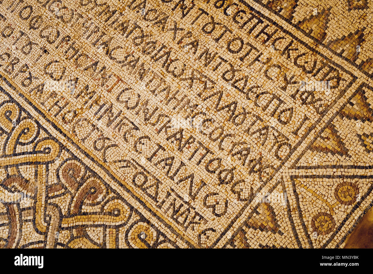 Ancient scriptures on a mosaic pattern in Madaba Archaeological Park ...