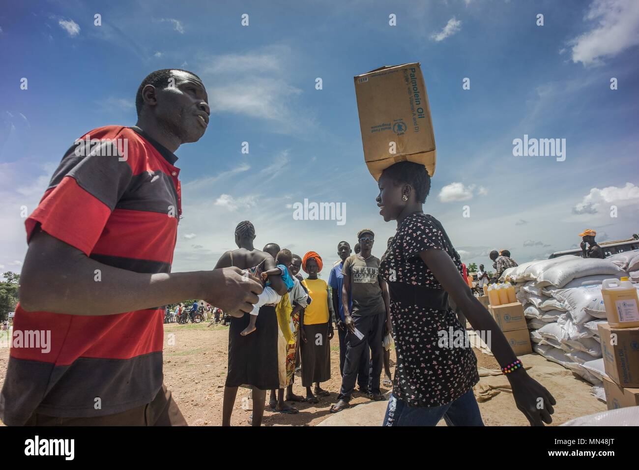 May 7, 2018 - Bidi Bidi, Uganda - A female South Sudanese refugee seen carrying palm oil ...