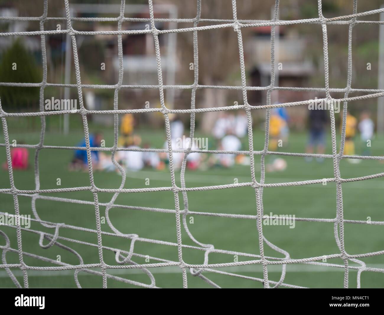Hang bended white black soccer nets soccer football net. Grass on ...