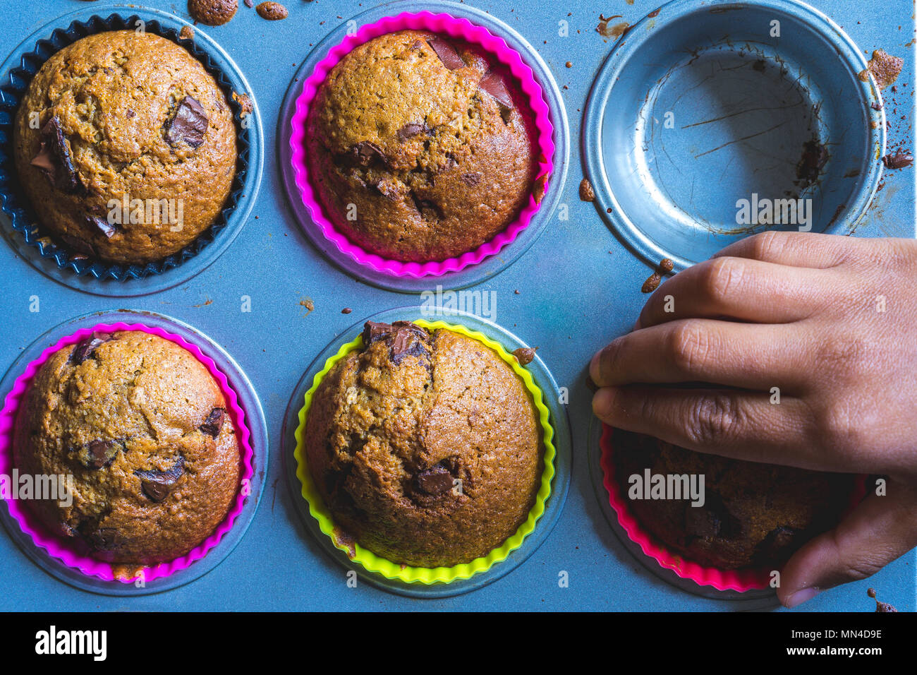 kid grabbing a muffin Stock Photo - Alamy
