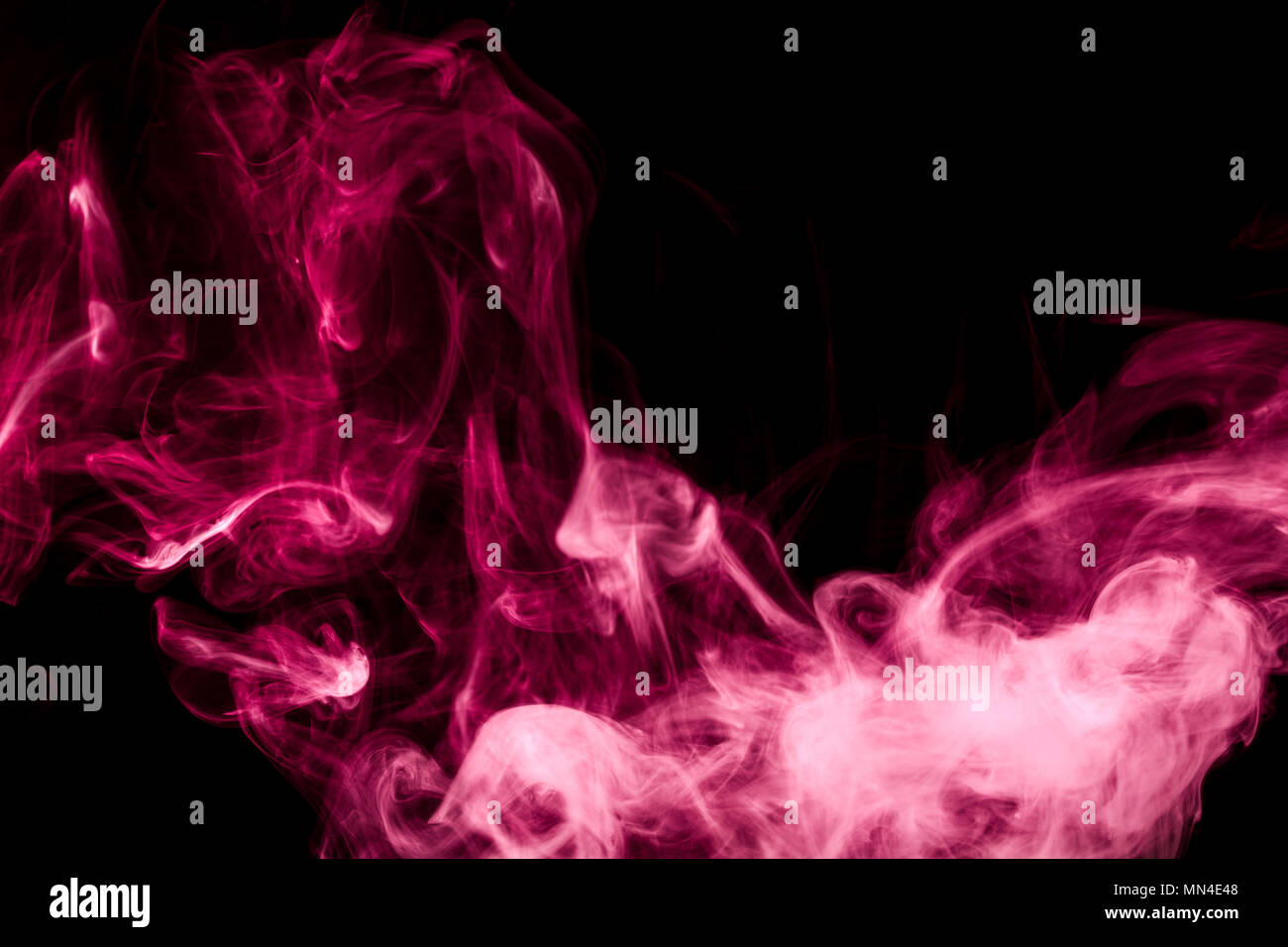Thick pink colorful smoke on a black isolated background. Background ...