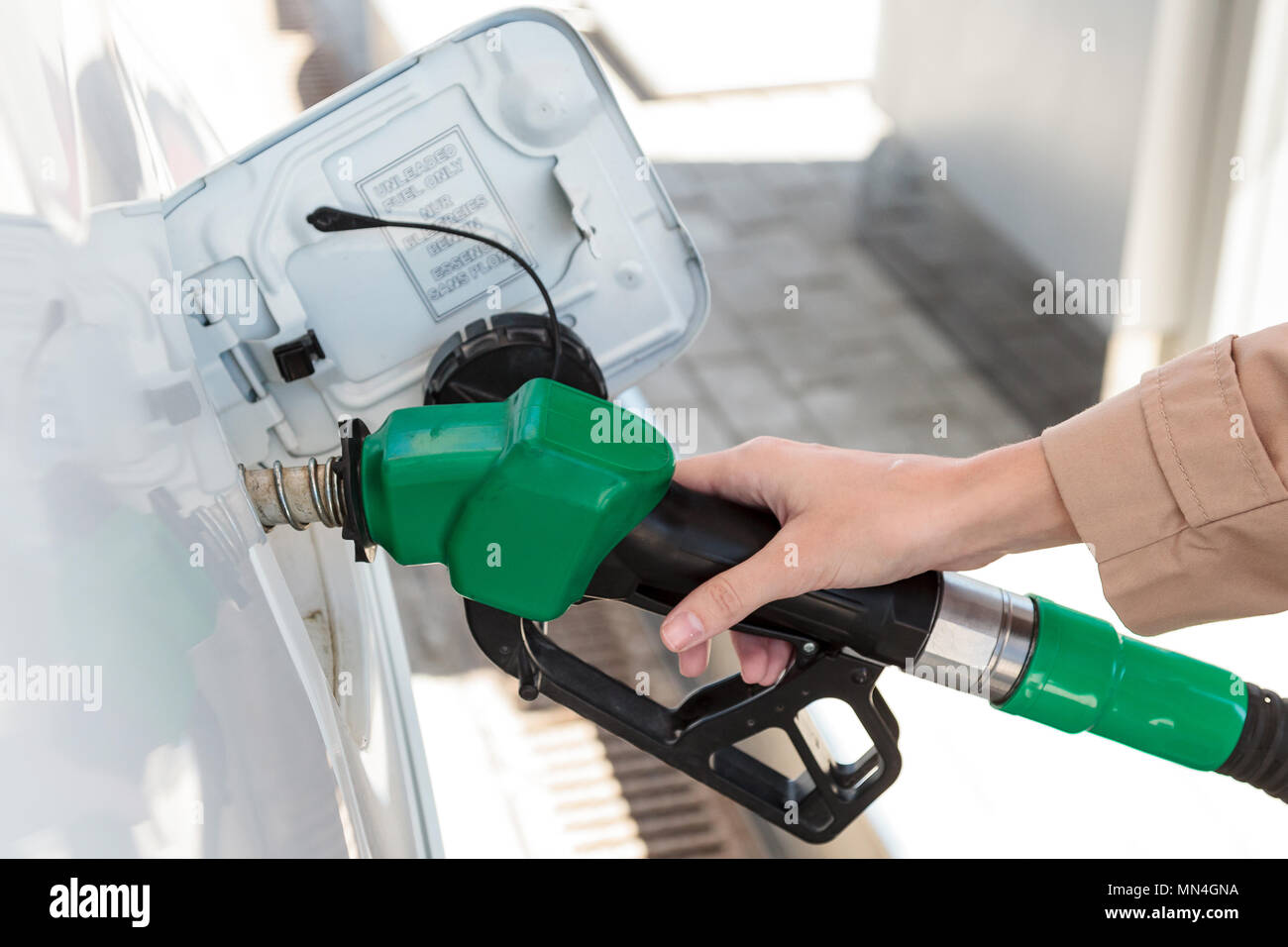 Female pumping gas hi-res stock photography and images - Alamy