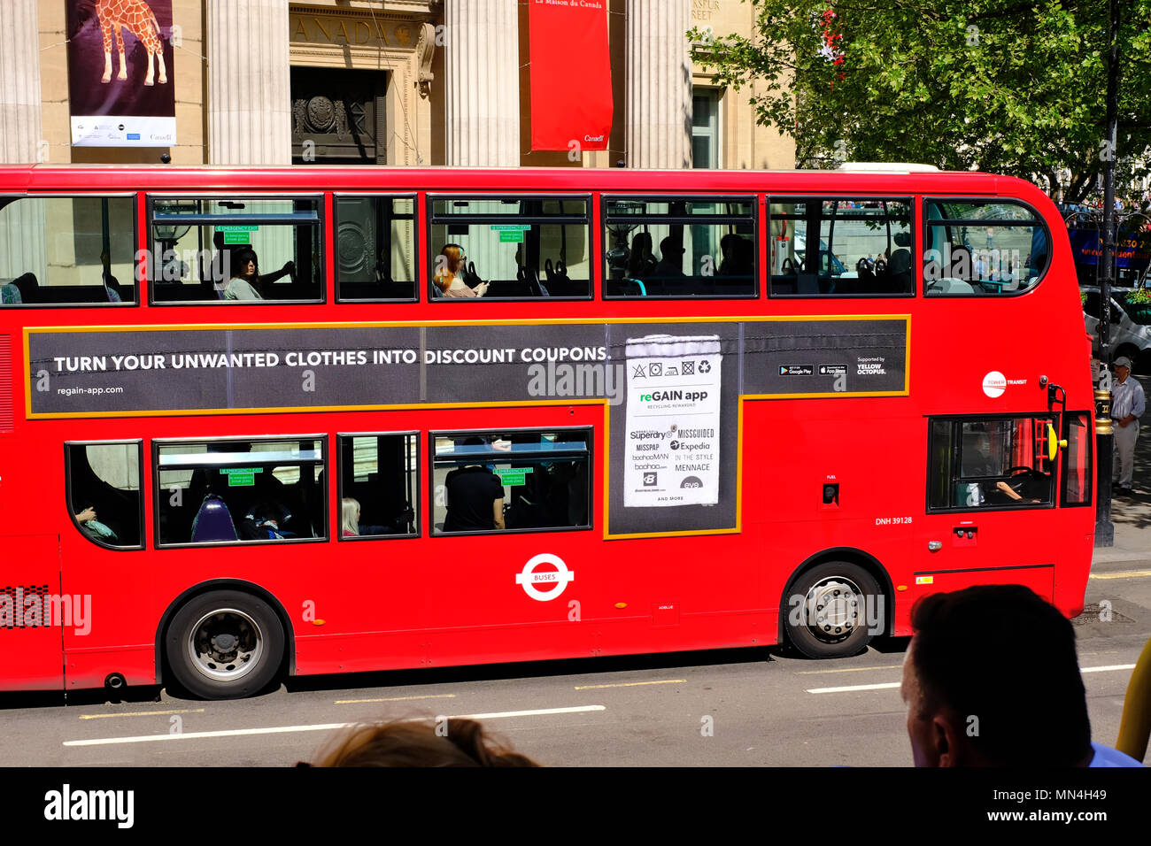 Red bus passing the Canadian High Commission - London Stock Photo - Alamy