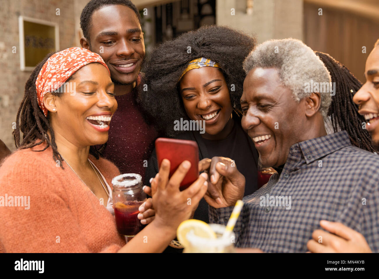Happy multi-generation family using smart phone Stock Photo - Alamy