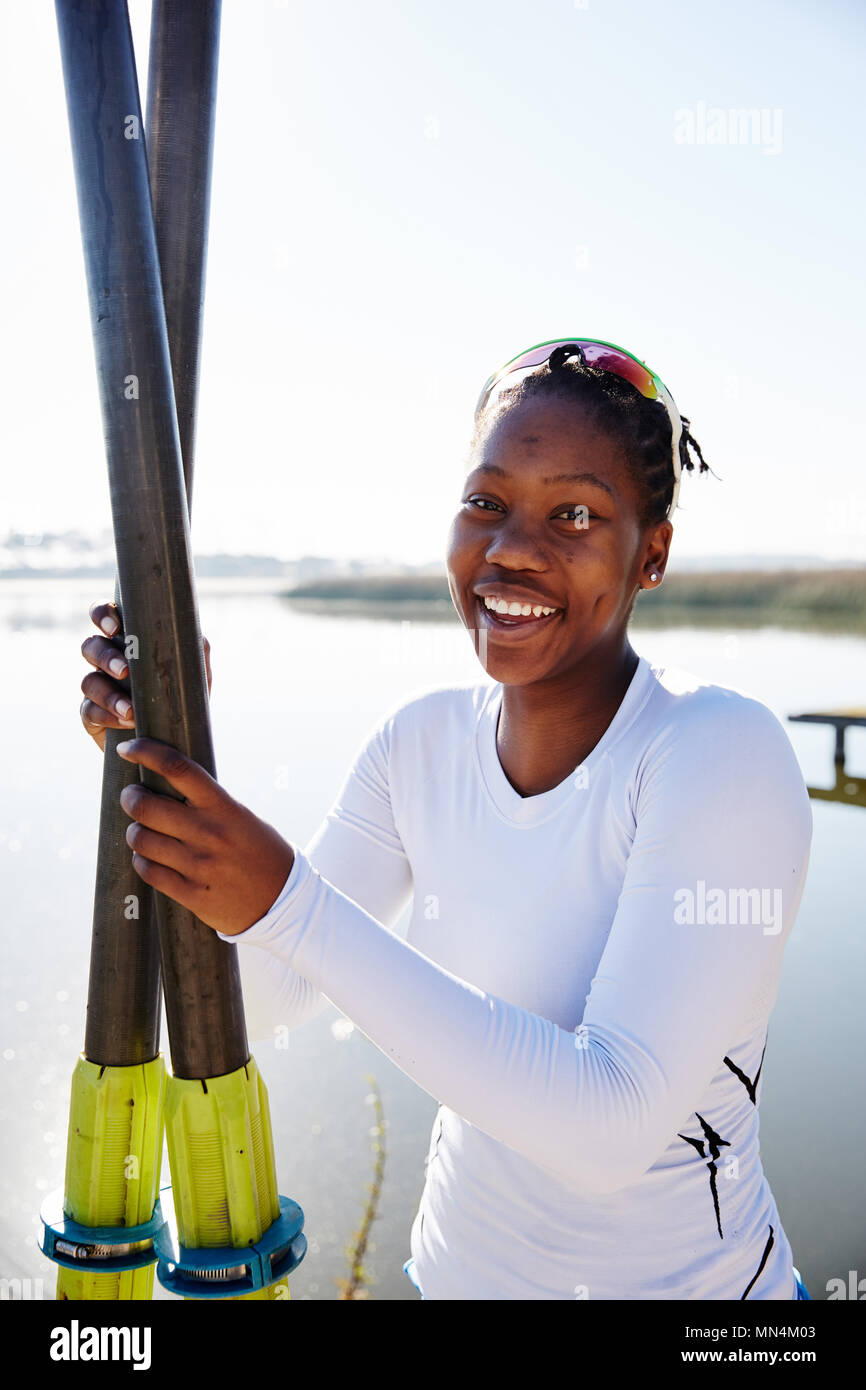 Smiling holding oars sport hi-res stock photography and images - Alamy