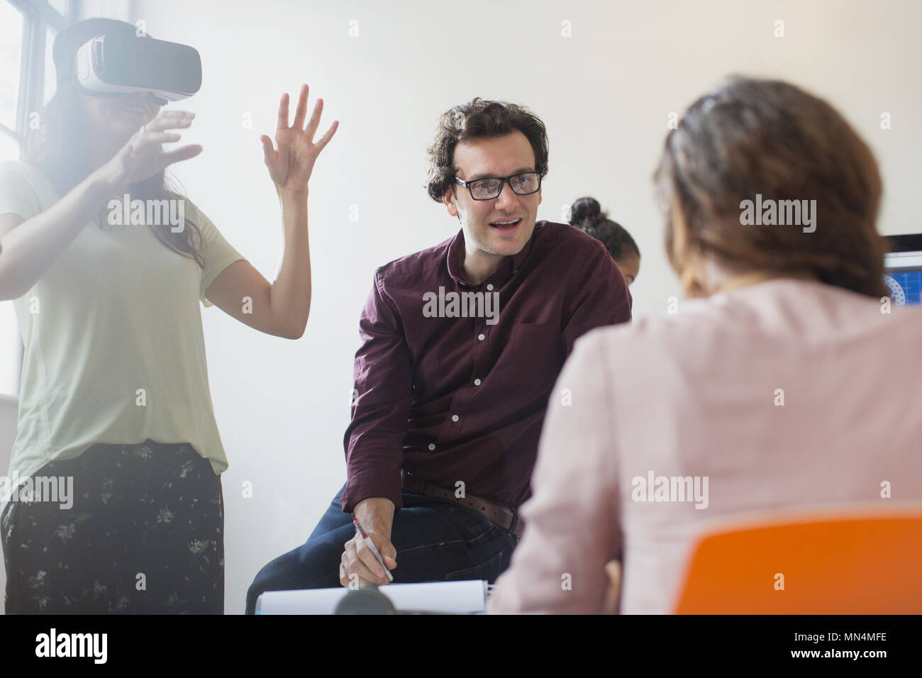 Computer Programmers Testing Virtual Reality Simulator Glasses In