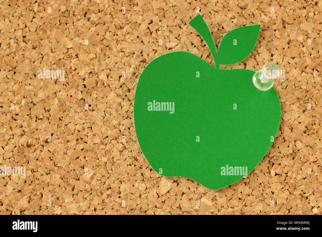 Apple shaped paper note on pinboard Stock Photo - Alamy