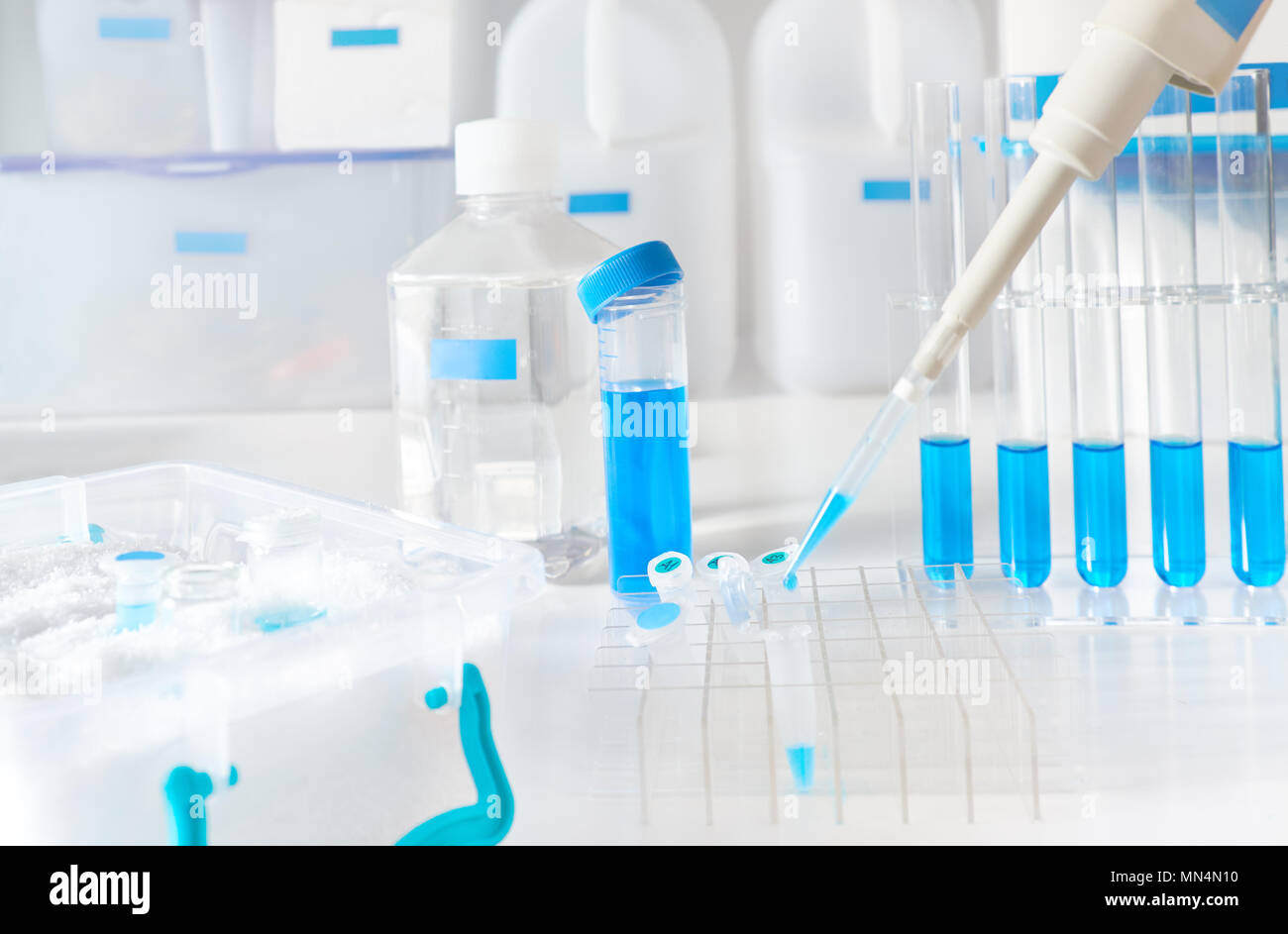 Scientific background in blue and white. Liquid sample loading with ...