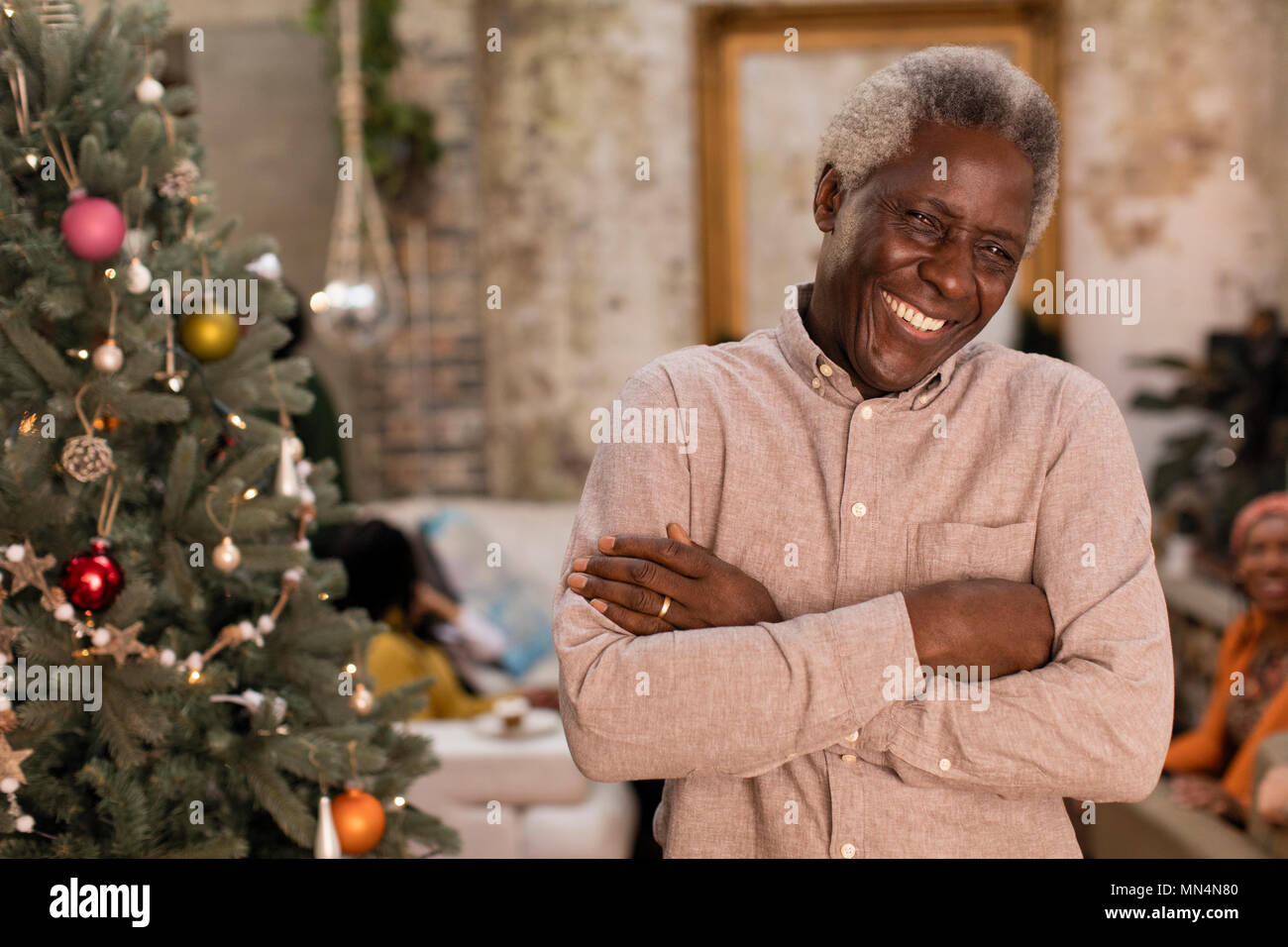 Standing next to christmas tree hi-res stock photography and images - Alamy