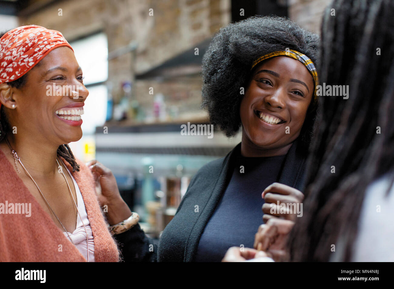 Happy mother and daughter laughing Stock Photo - Alamy