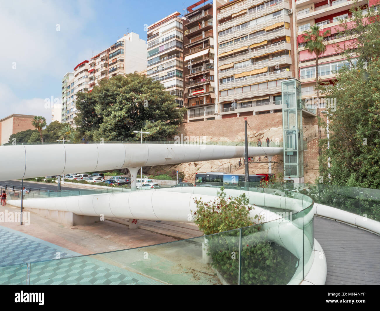 a futuristic pedestrian bridge connects the palaces at the base of the ...