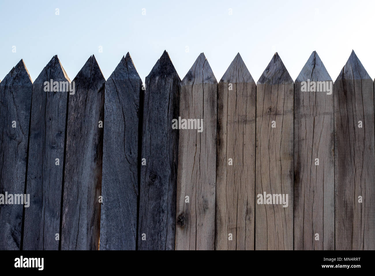 Spiked wooden fence Stock Photo - Alamy