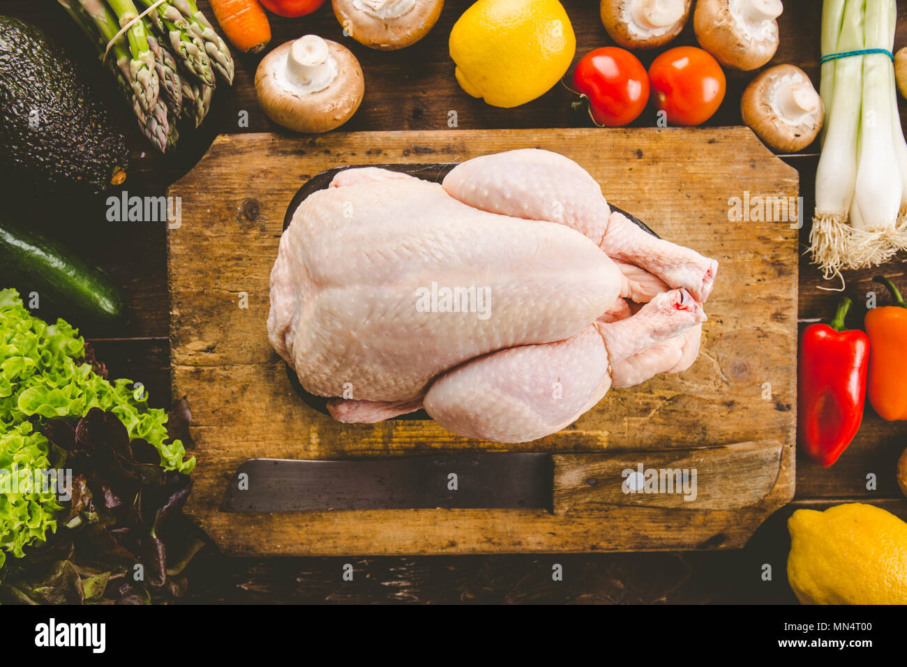 Top View of Preparing fresh raw chicken. Poultry on an old vintage ...