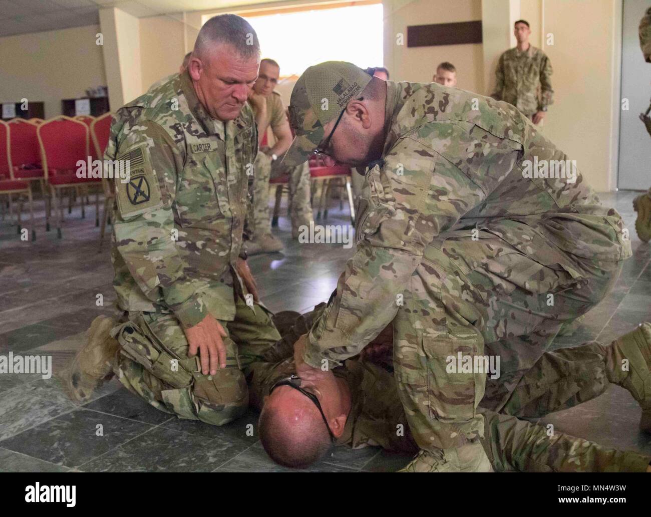 Task Force Leopard Medical NCOIC, SSG Sergio Orozco, shows Maj. Daryl ...
