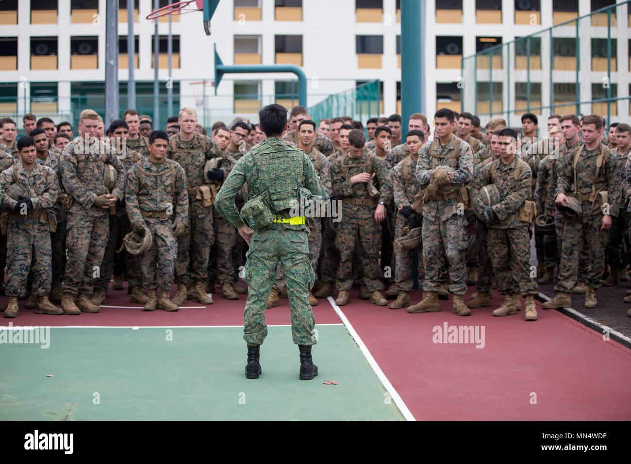 A Singapore Armed Forces Soldier briefs U.S. Marines and Sailors on ...