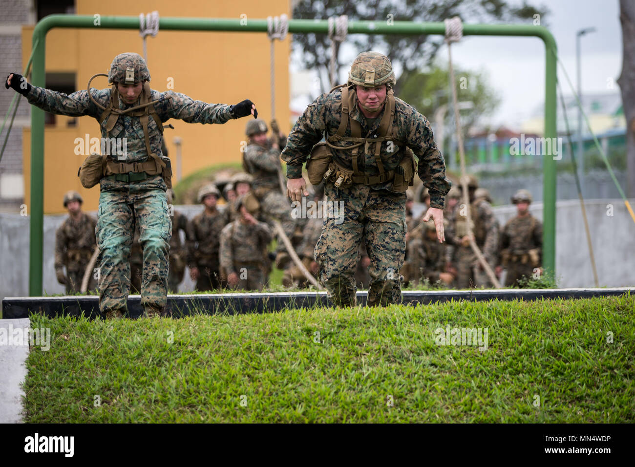 U.S. Marines and Sailors run through the vocation obstacle course ...