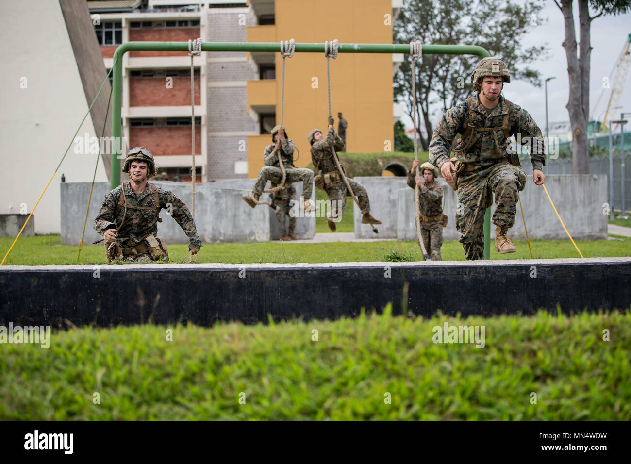 U.S. Marines and Sailors run through the vocation obstacle course ...