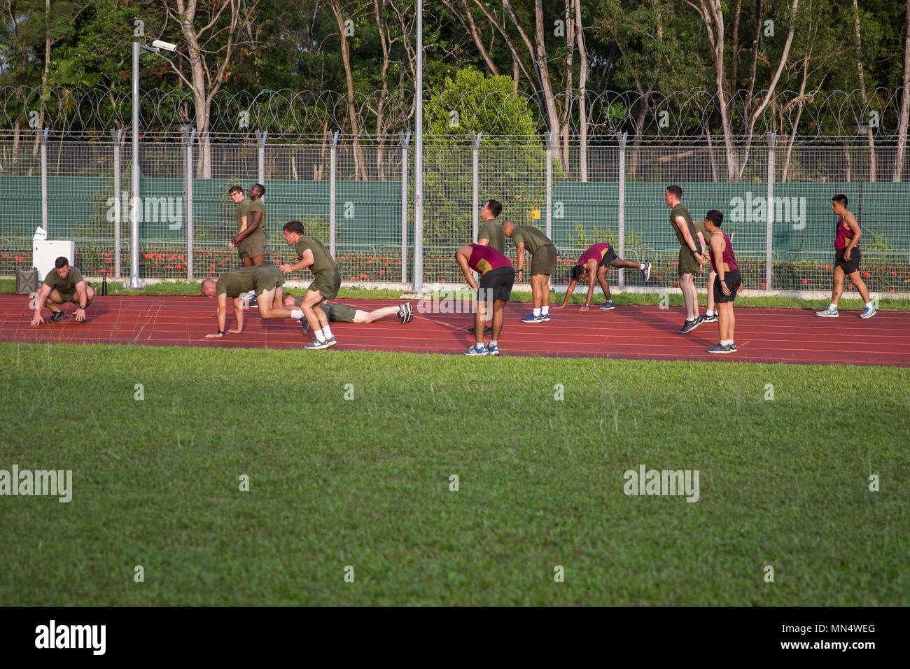 Multinational service members conduct physical training during Exercise ...