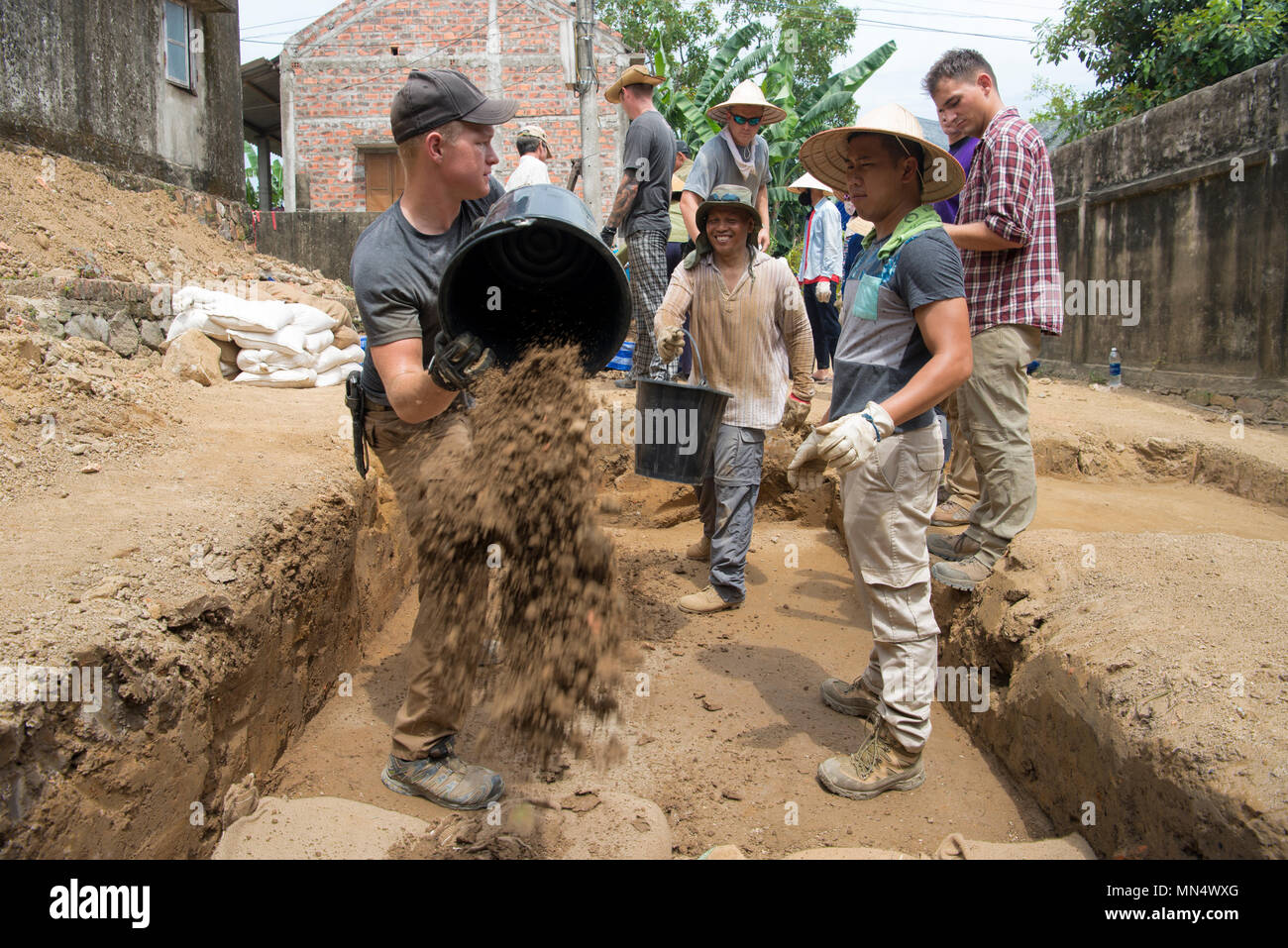 Defense POW/MIA Accounting Agency (DPAA) recovery team members work at ...