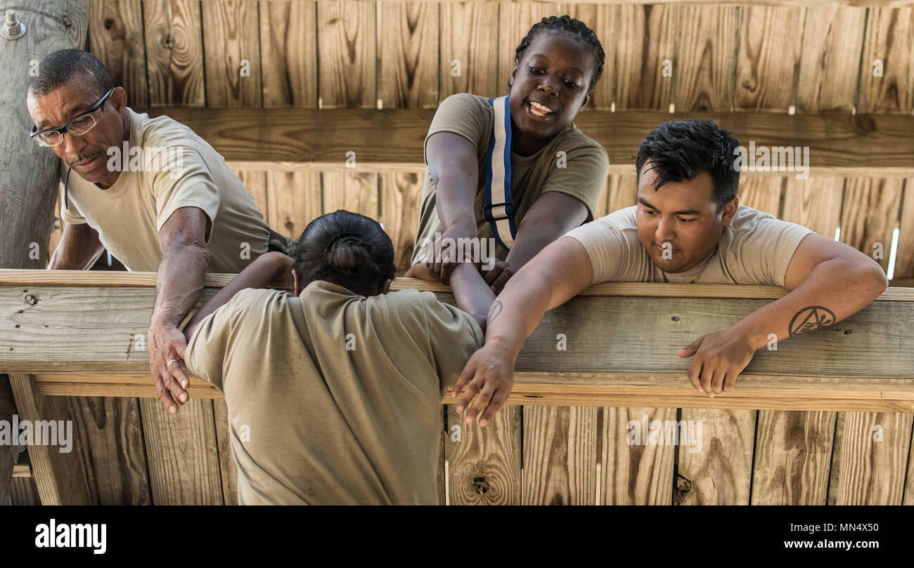 Three Soldiers from the 642nd Regional Support Group help pull their ...