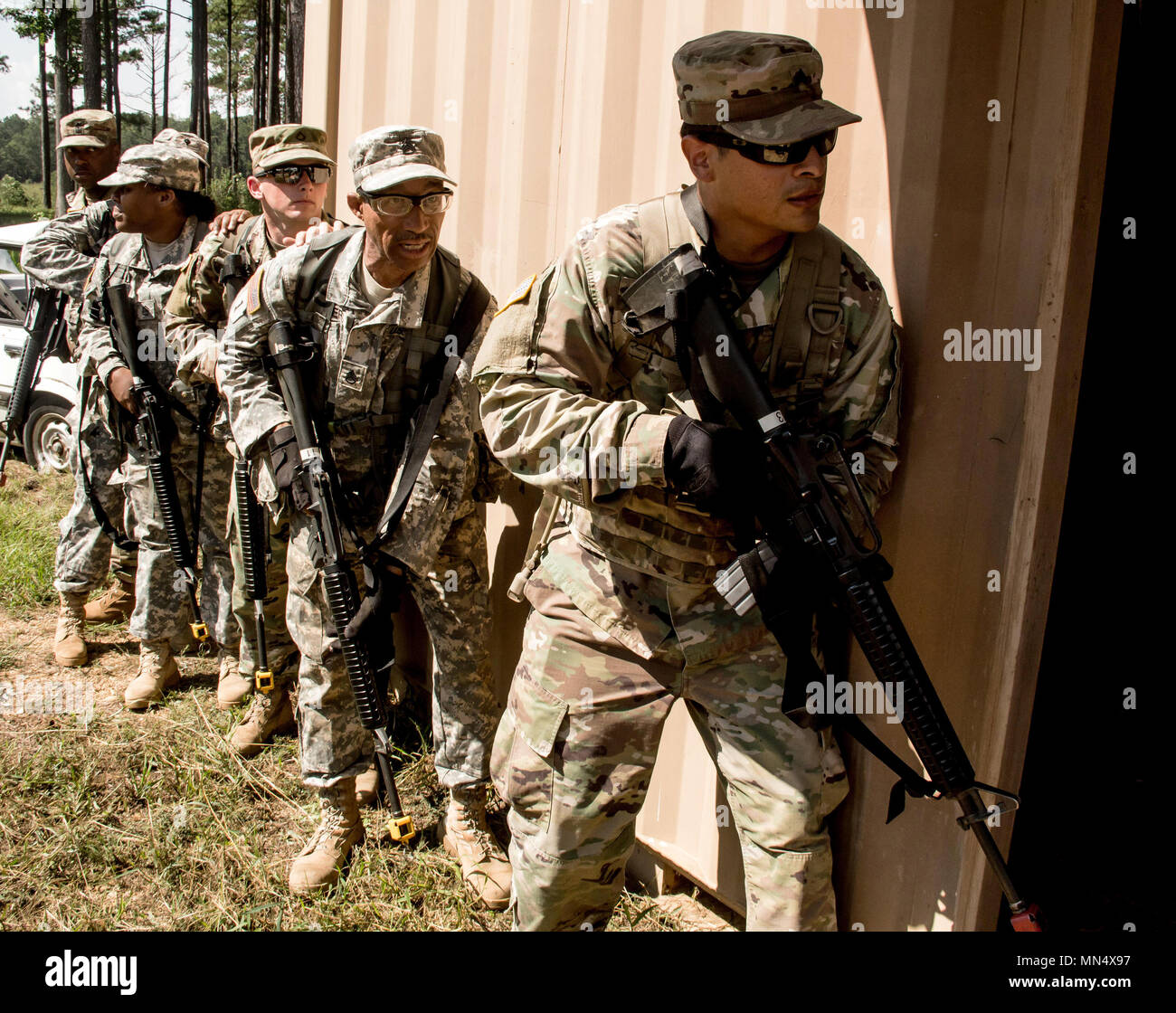 Soldiers from the 642nd Regional Support Group prepare to clear a ...