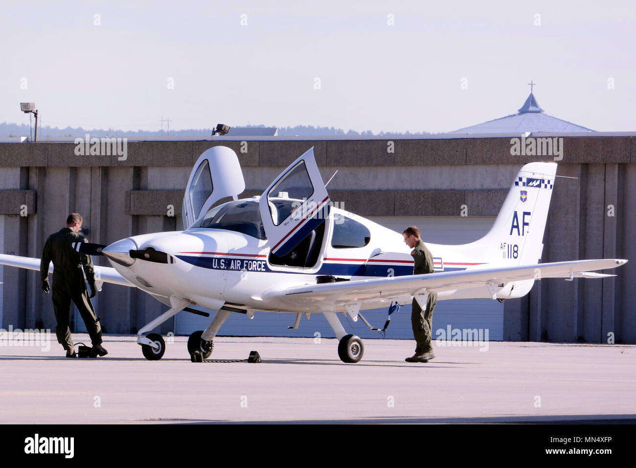 A cadet and his instructor pilot perform a pre-flight inspection on a T ...