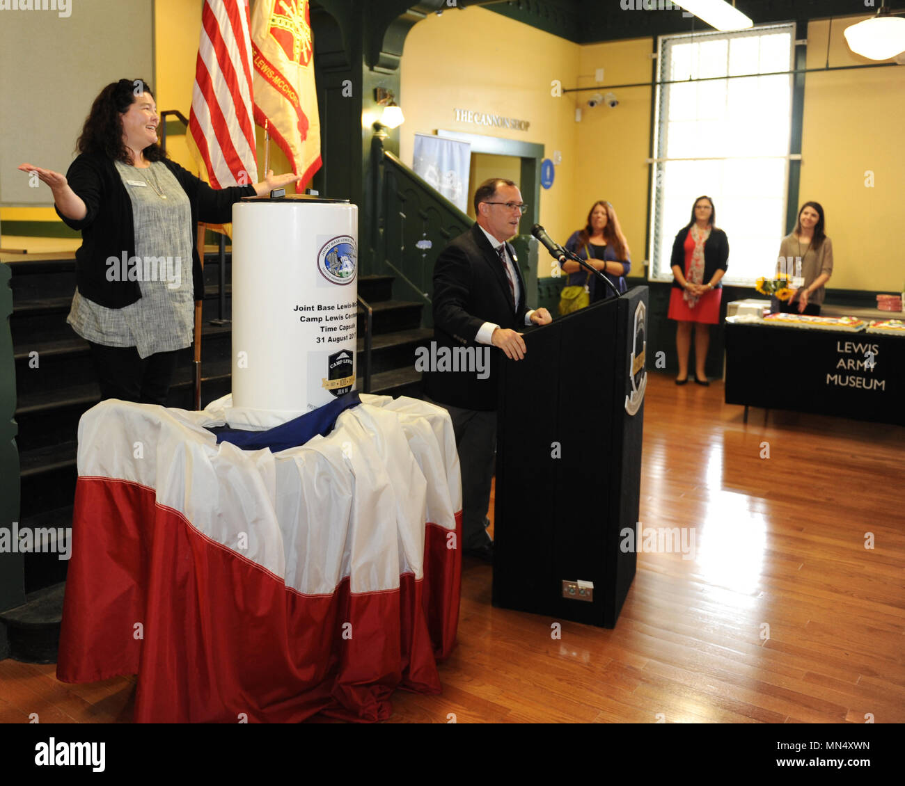 Lewis Army Museum Curator Heidi Pierson (left) celebrates the sealing ...