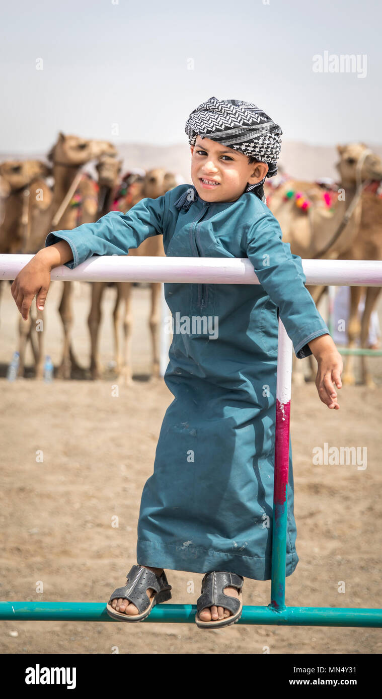 Ibri, Oman, 28th April 2018: omani kid at a camel race in a countryside ...