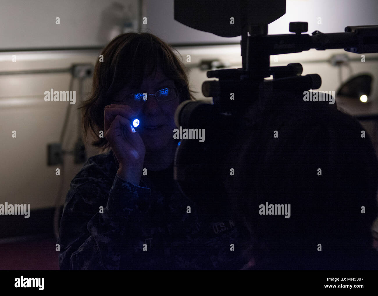 Navy Cmdr. Bonnie Garbutt, an optometrist assigned to Naval Hospital ...
