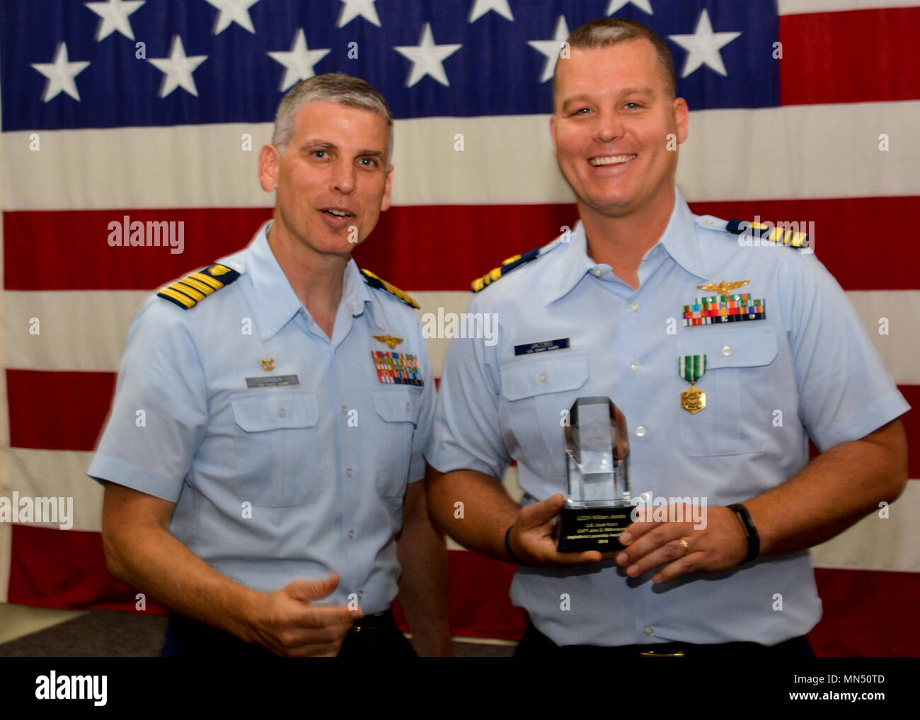 Lt. Cmdr. Jeff Jacobs, right, crewmember at Coast Guard Air Station ...