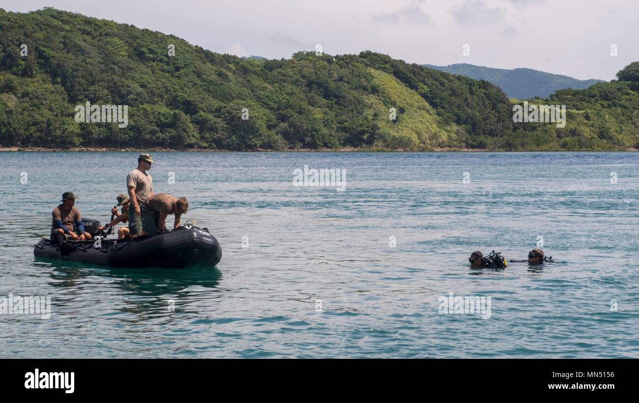 U.S. Navy Sailors attached to Underwater Construction Team (UCT) 2, and ...